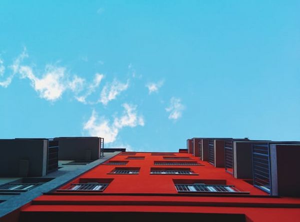 Red painted apartment block - modlar.com